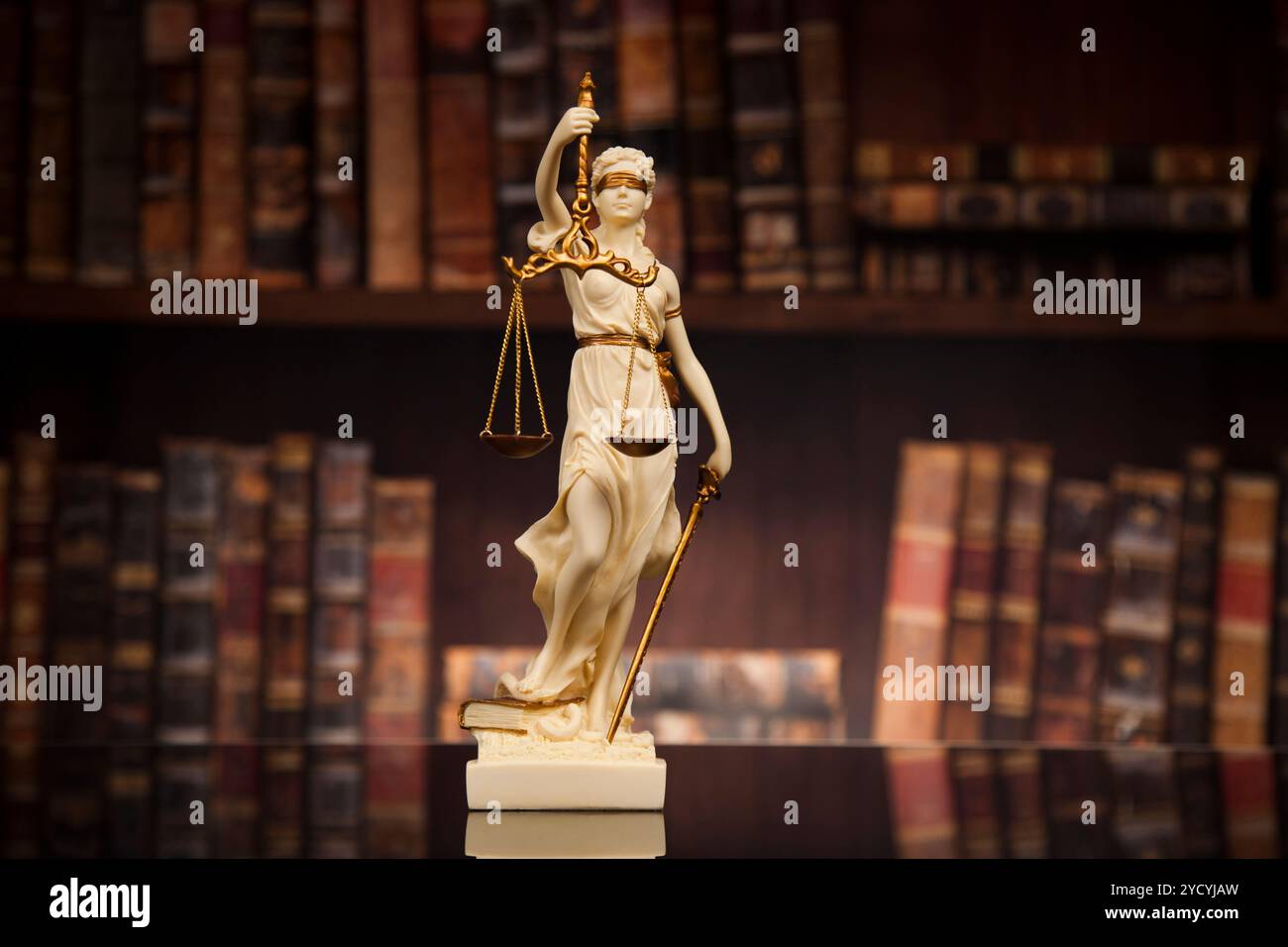 Antique statue of justice, law, books background Stock Photo - Alamy