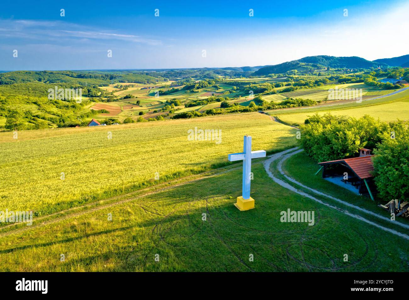 Cross on the hill in rural mountain village of Apatovec Stock Photo - Alamy