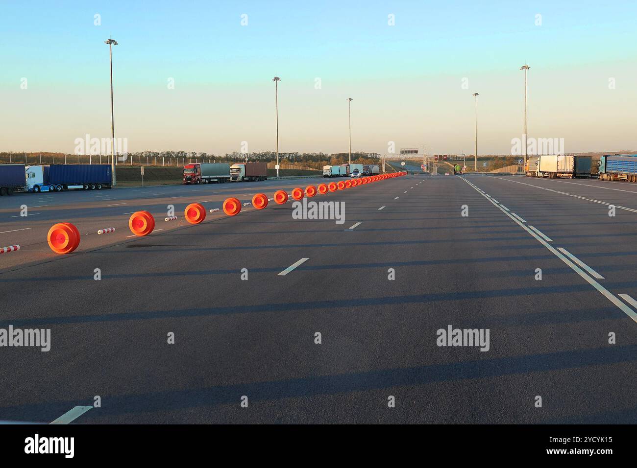 Road with bright, movable barrier used to establish a physical ...