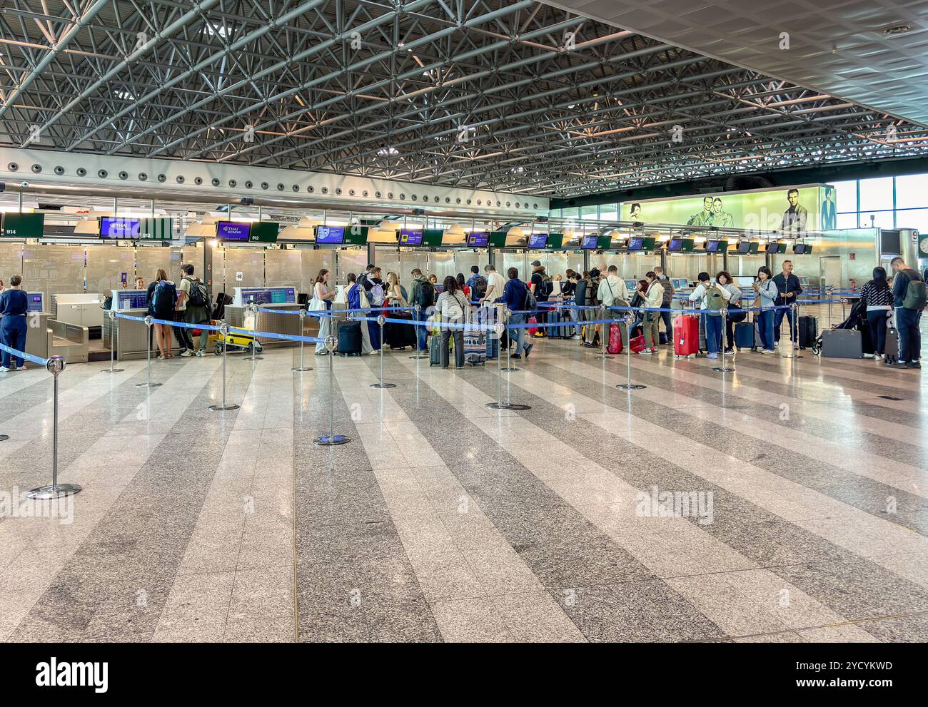 Ferno, Milan-Malpensa, Italy - September 29, 2024: Passengers lined up ...
