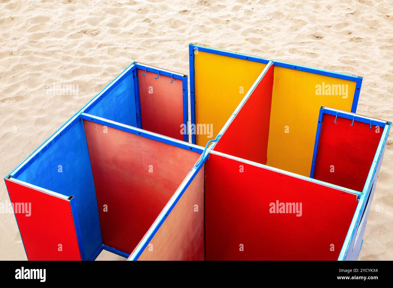 Multicolored beach changing rooms at the sandy beach Stock Photo - Alamy