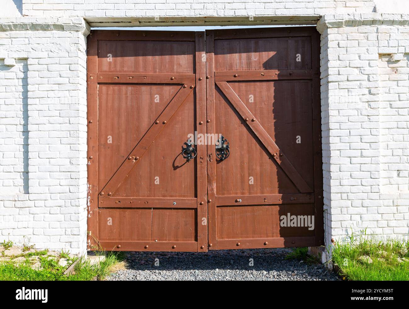 Traditional russian massive wooden gate with metal knobs Stock Photo ...