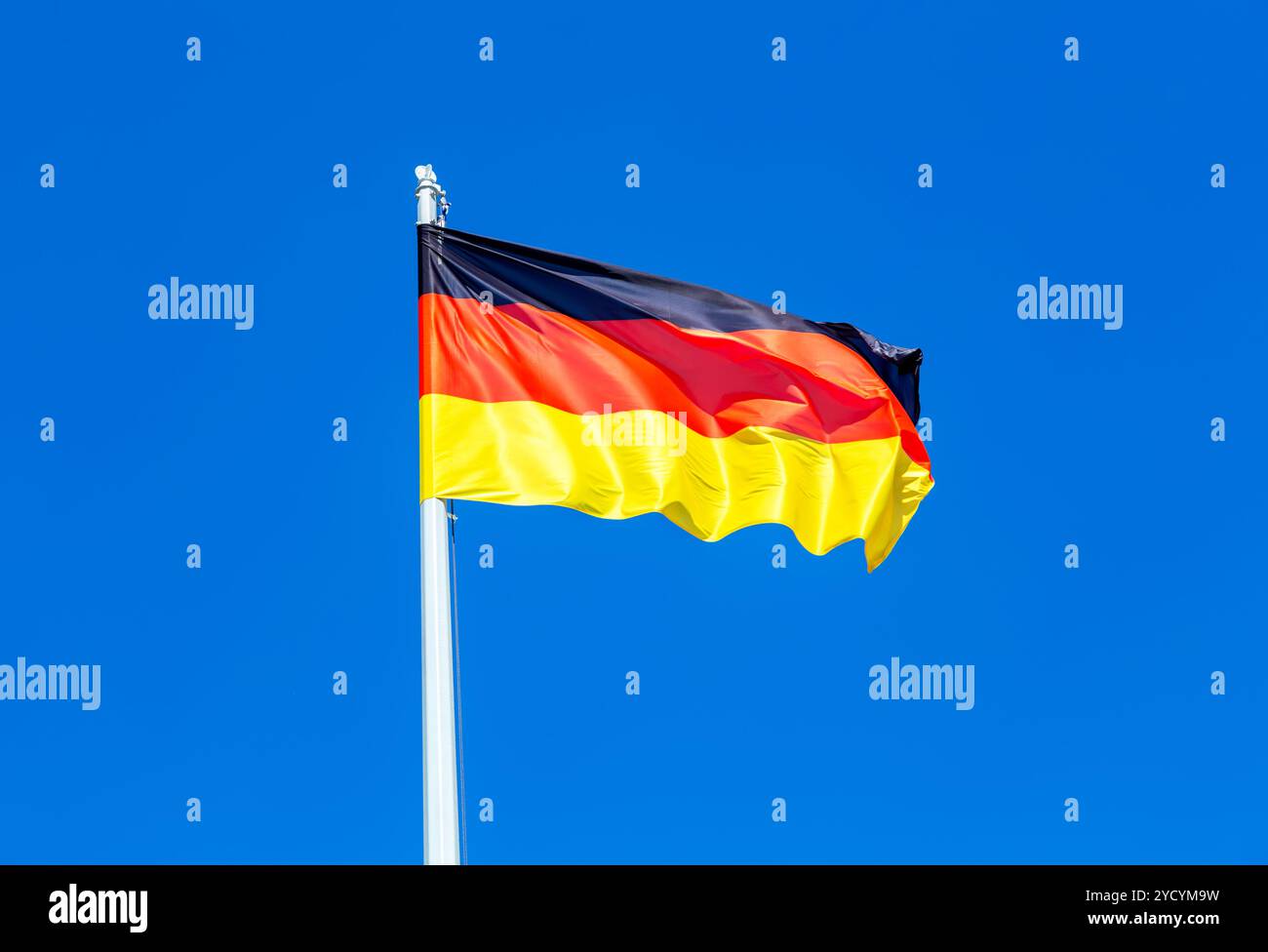 German flag against blue sky hi-res stock photography and images - Alamy