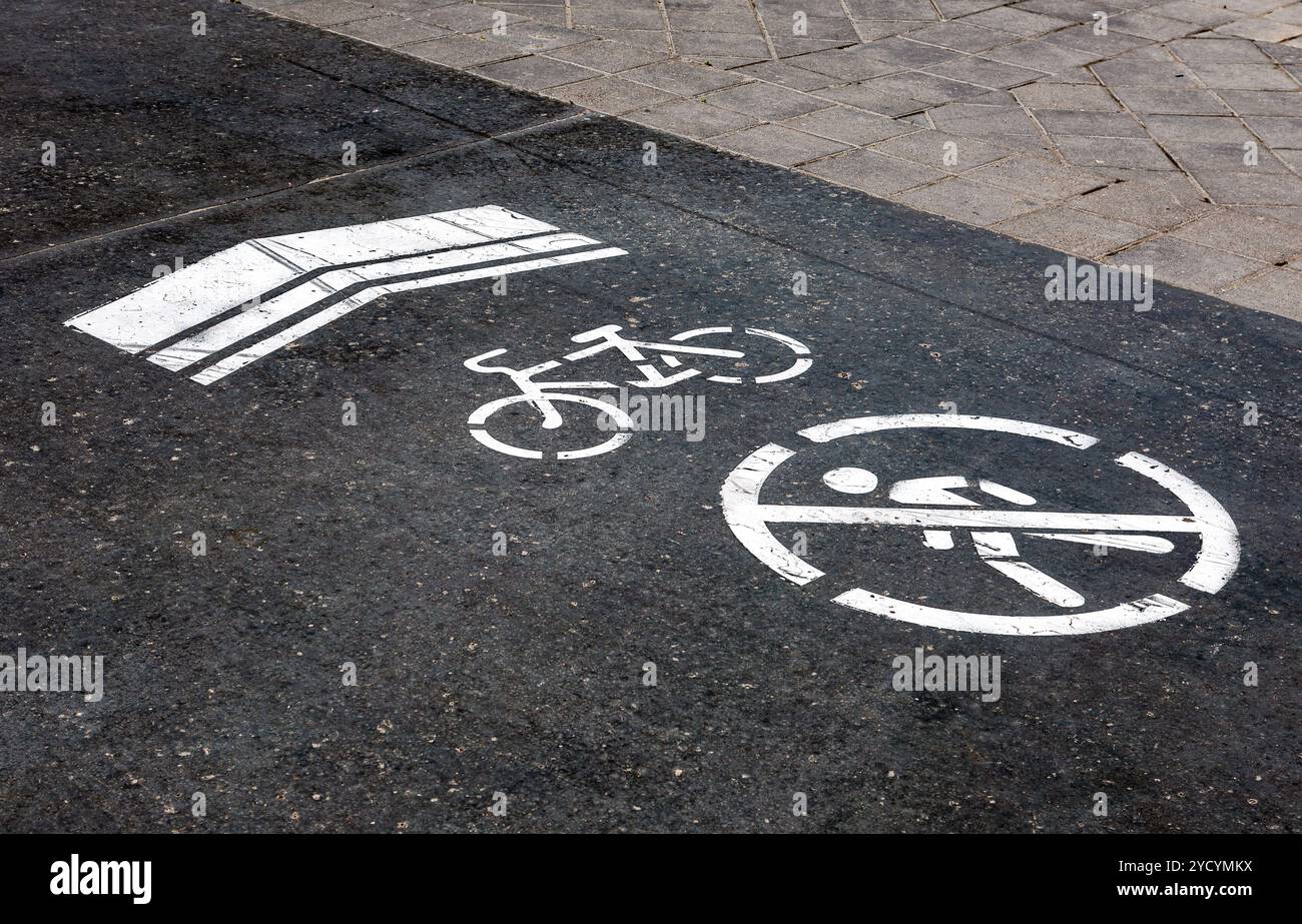 Bike lane with road symbols Stock Photo - Alamy