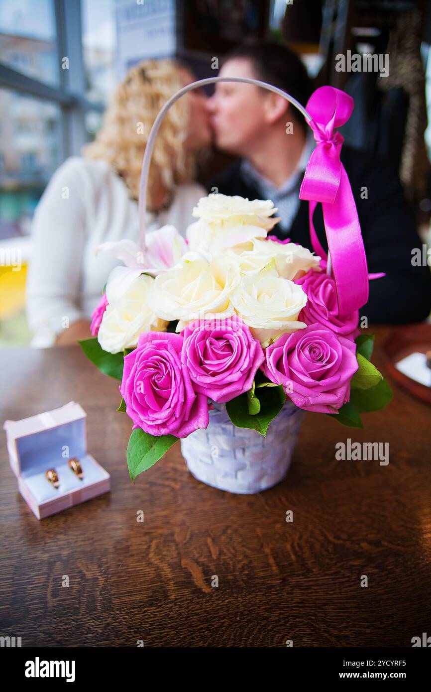 Couple kissing with flowers hi-res stock photography and images - Alamy