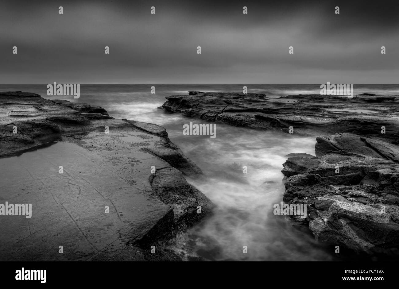 Moody seascape ocean rock channel Stock Photo - Alamy