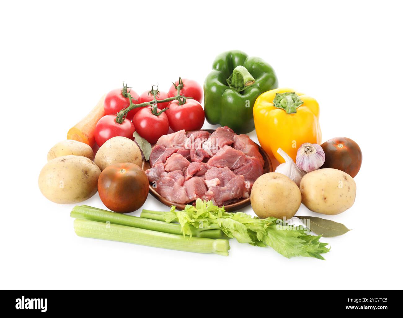 Cooking stew. Uncooked meat and vegetables isolated on white Stock ...