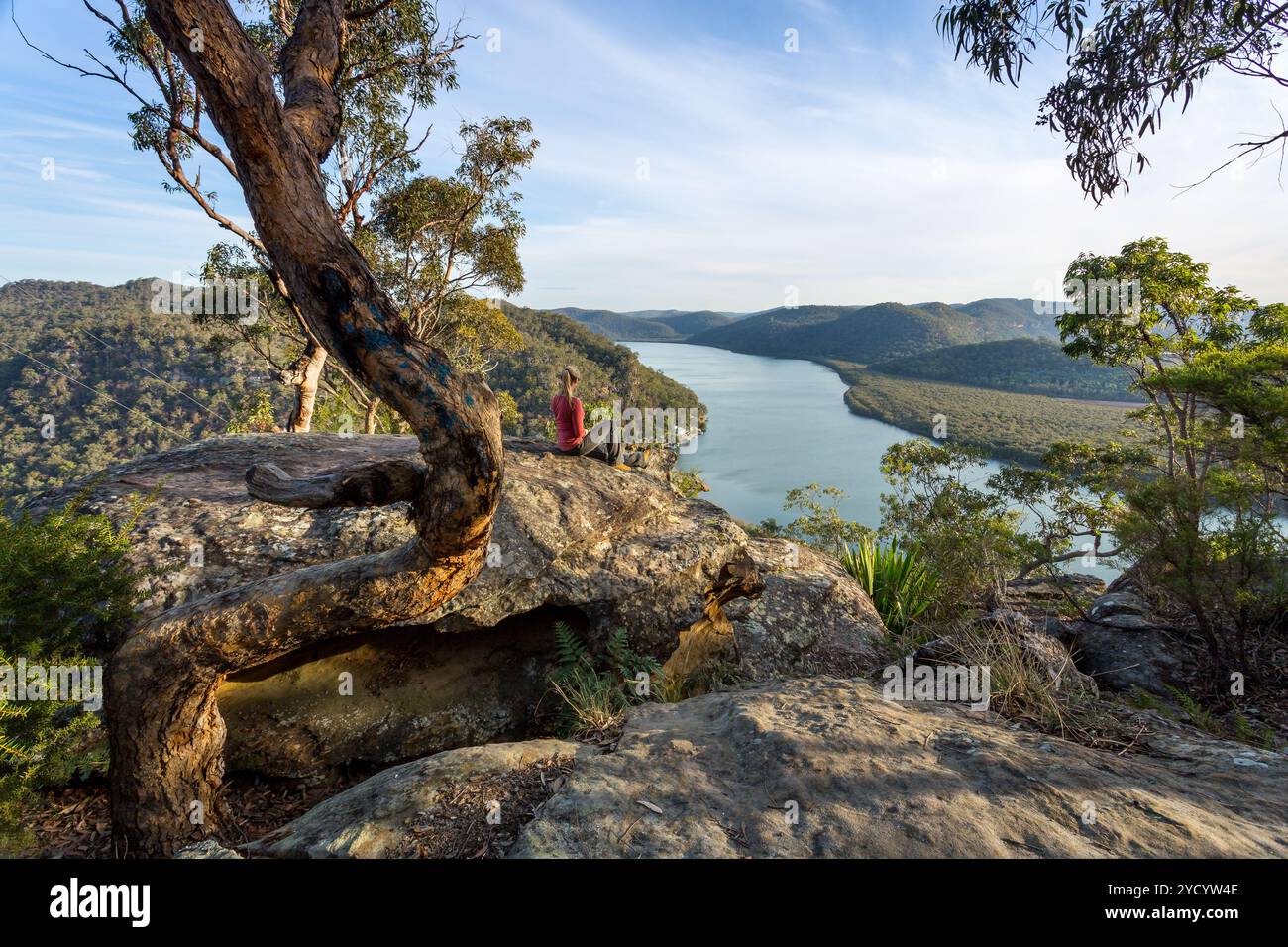 Woman chillaxing with river views in Australian bushland Stock Photo ...
