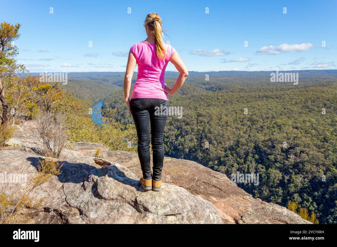Bush walker admiring views high above the river Stock Photo - Alamy