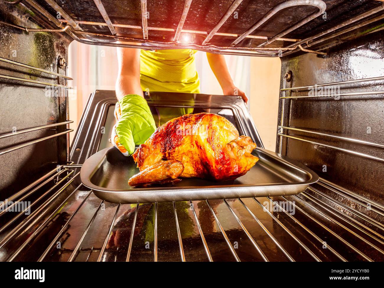 Cooking chicken in the oven at home Stock Photo - Alamy