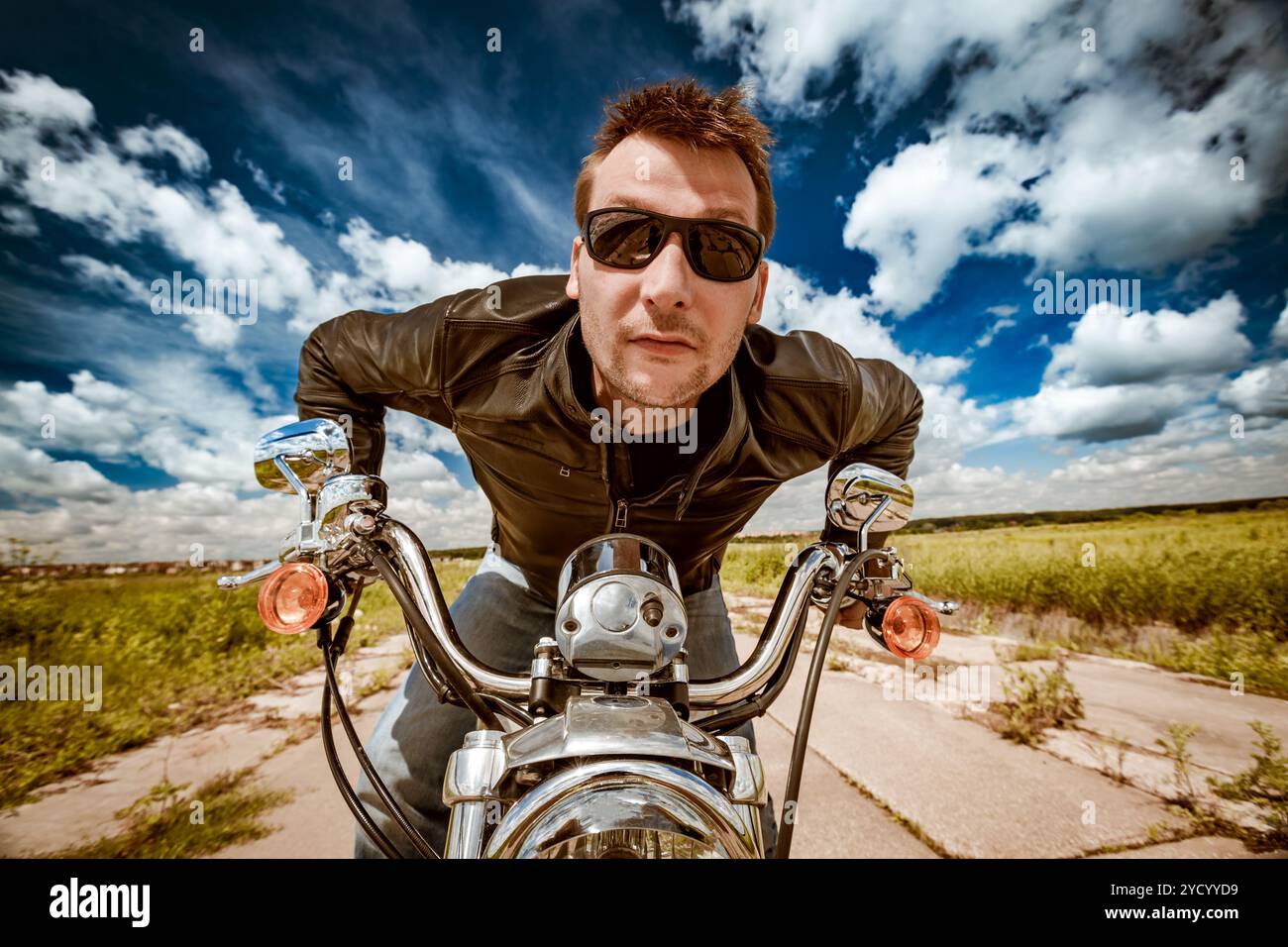 Biker racing on the road Stock Photo - Alamy