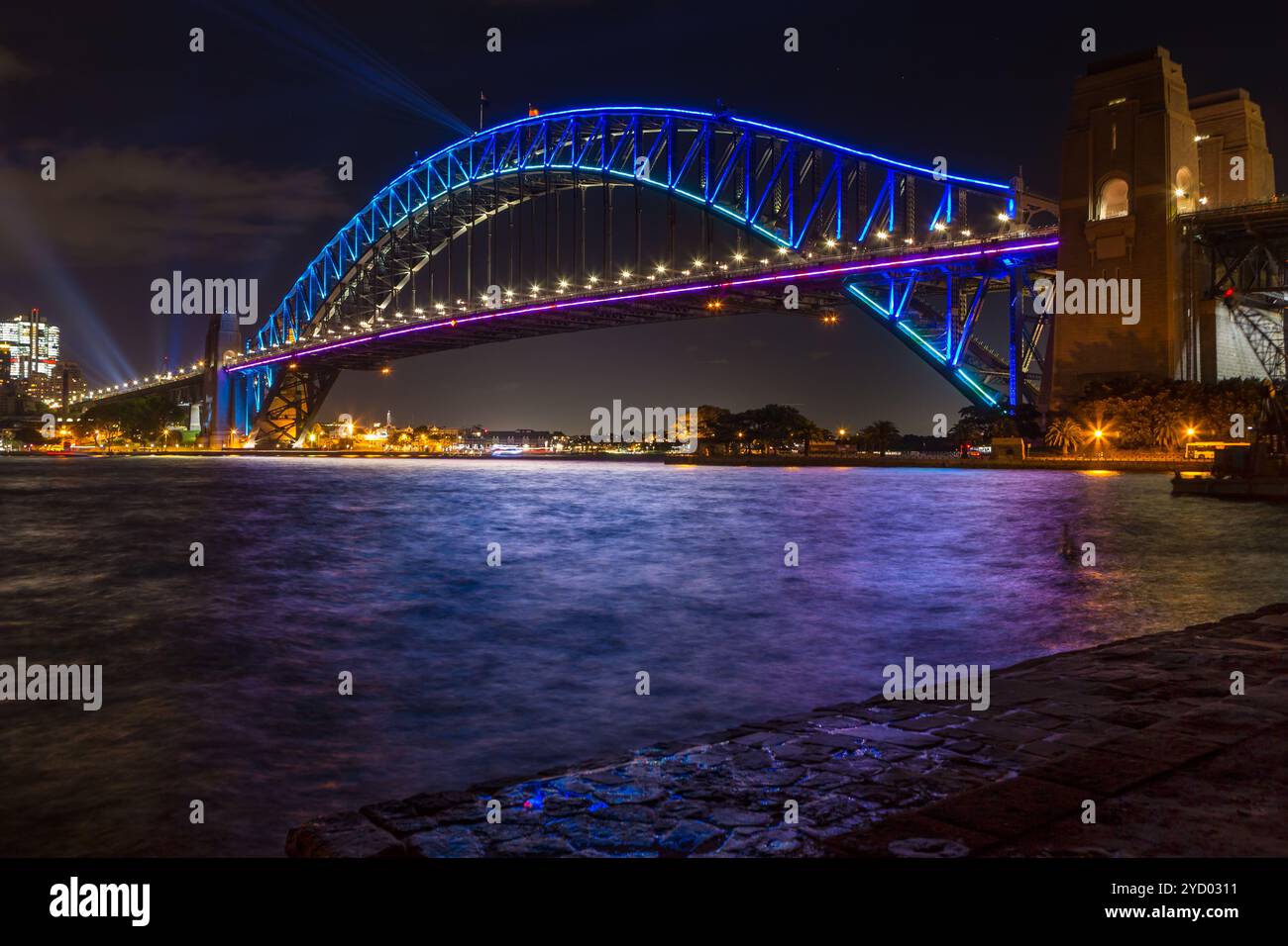 Sydney Harbour Bridge lit up in blue colours Stock Photo - Alamy