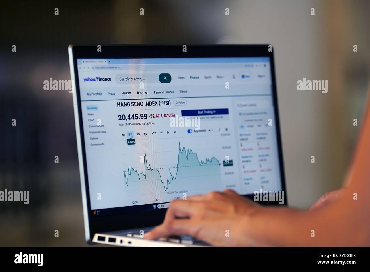 In this photo illustration, A woman browses Yahoo Finance website to ...