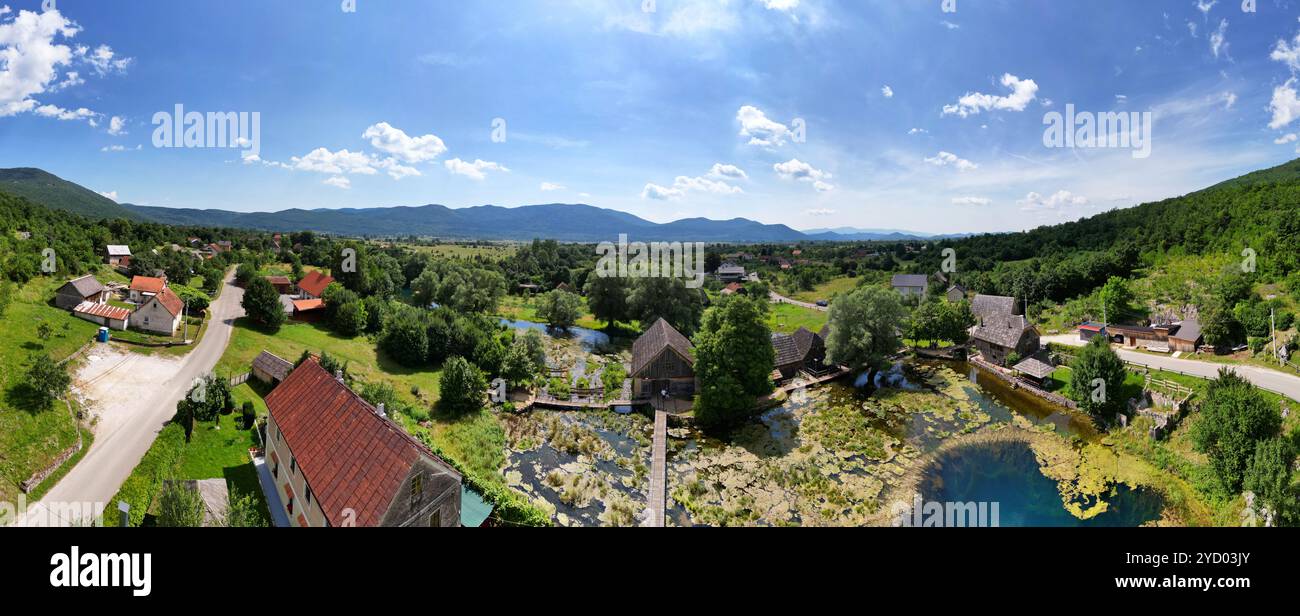 180 degree aerial panorama of Majerovo Vrilo, set of wooden mill houses ...