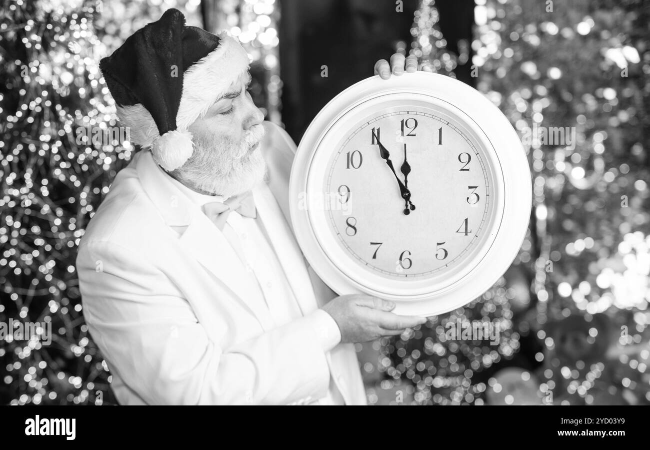 santa man hold alarm clock. new year midnight. time for party. clock ...