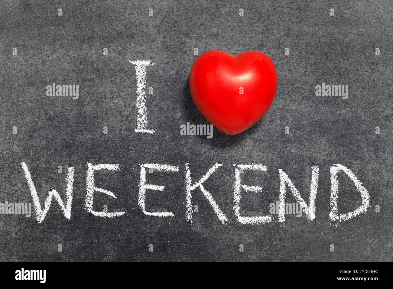 I love weekend phrase handwritten on blackboard with red heart symbol ...