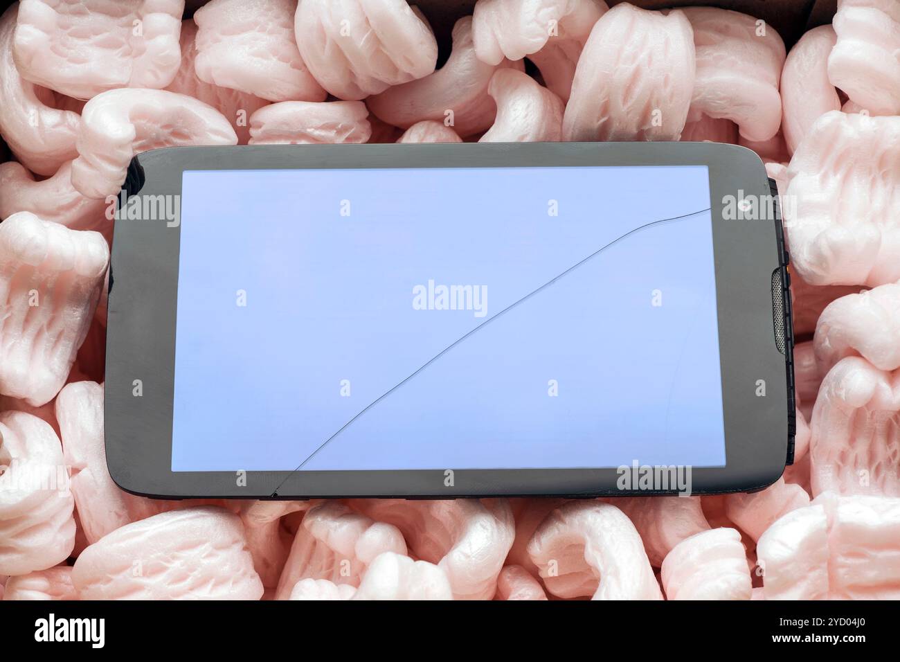 broken tablet PC screen inside packing box Stock Photo - Alamy