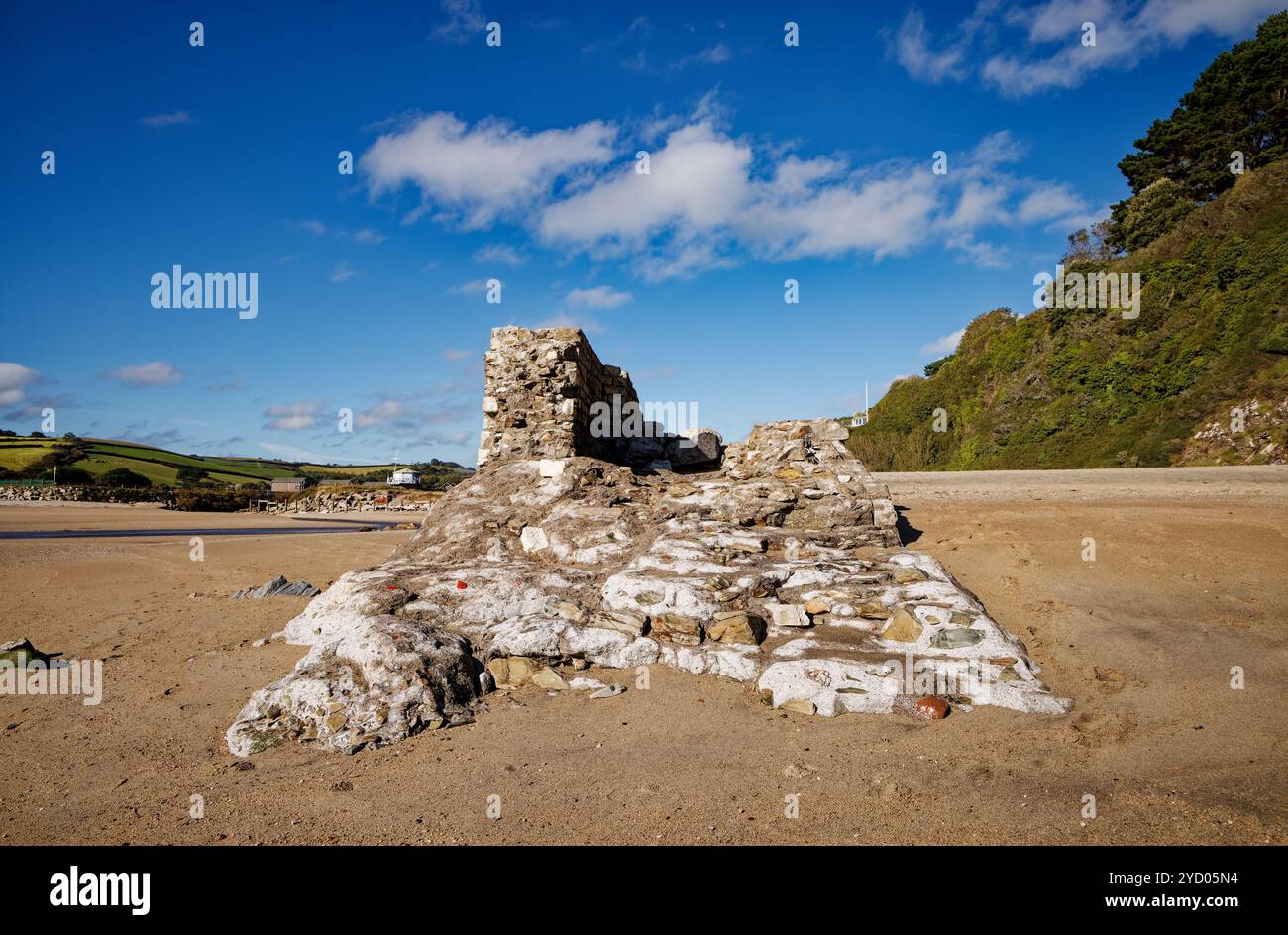 The remains of the old harbour wall on Pentewan Beach, Cornwall Stock ...