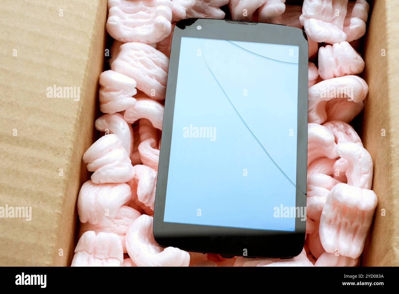 broken smartphone screen inside packing box Stock Photo - Alamy