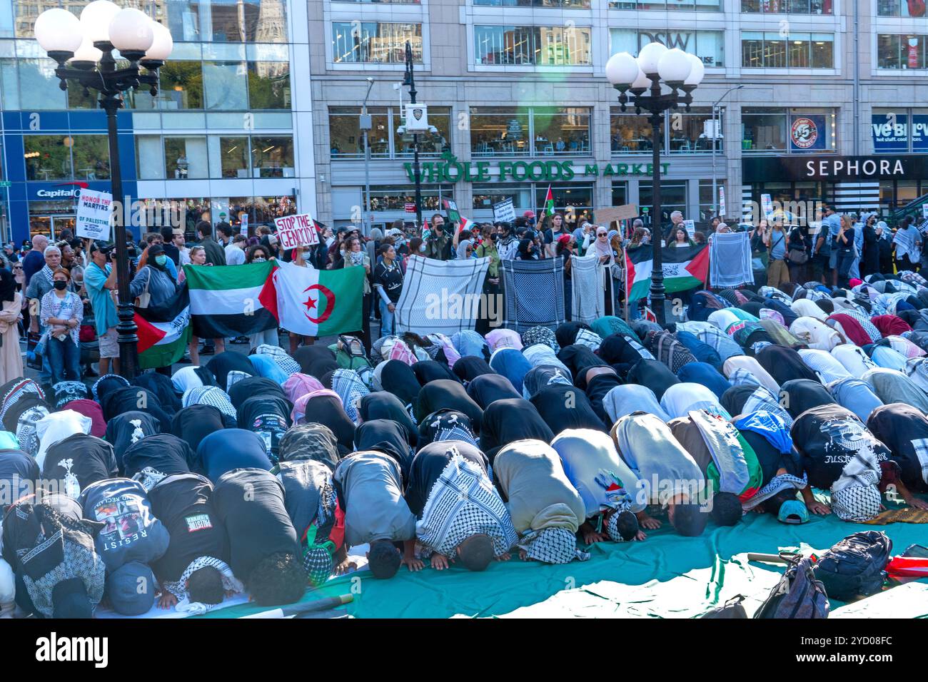 Muslim and other demonstrators pray together for the Palestinian people ...