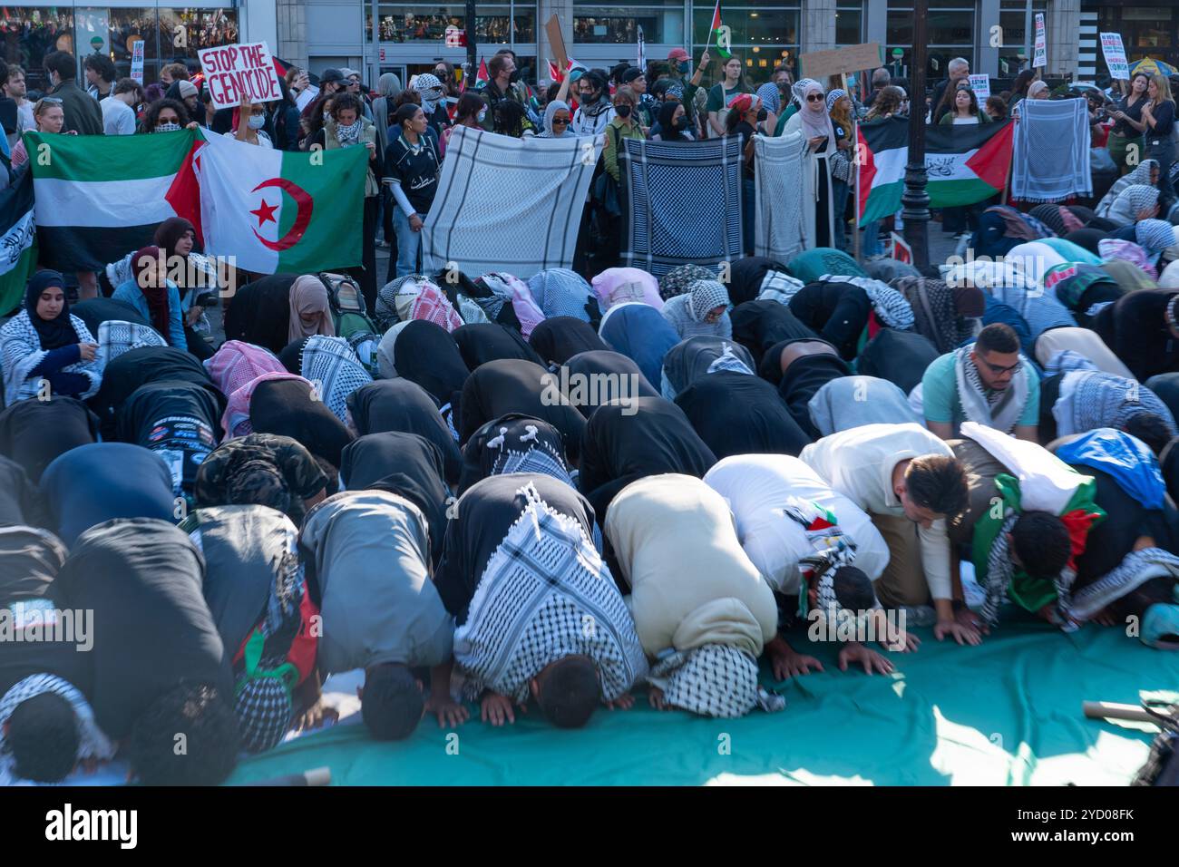 Muslim and other demonstrators pray together for the Palestinian people ...