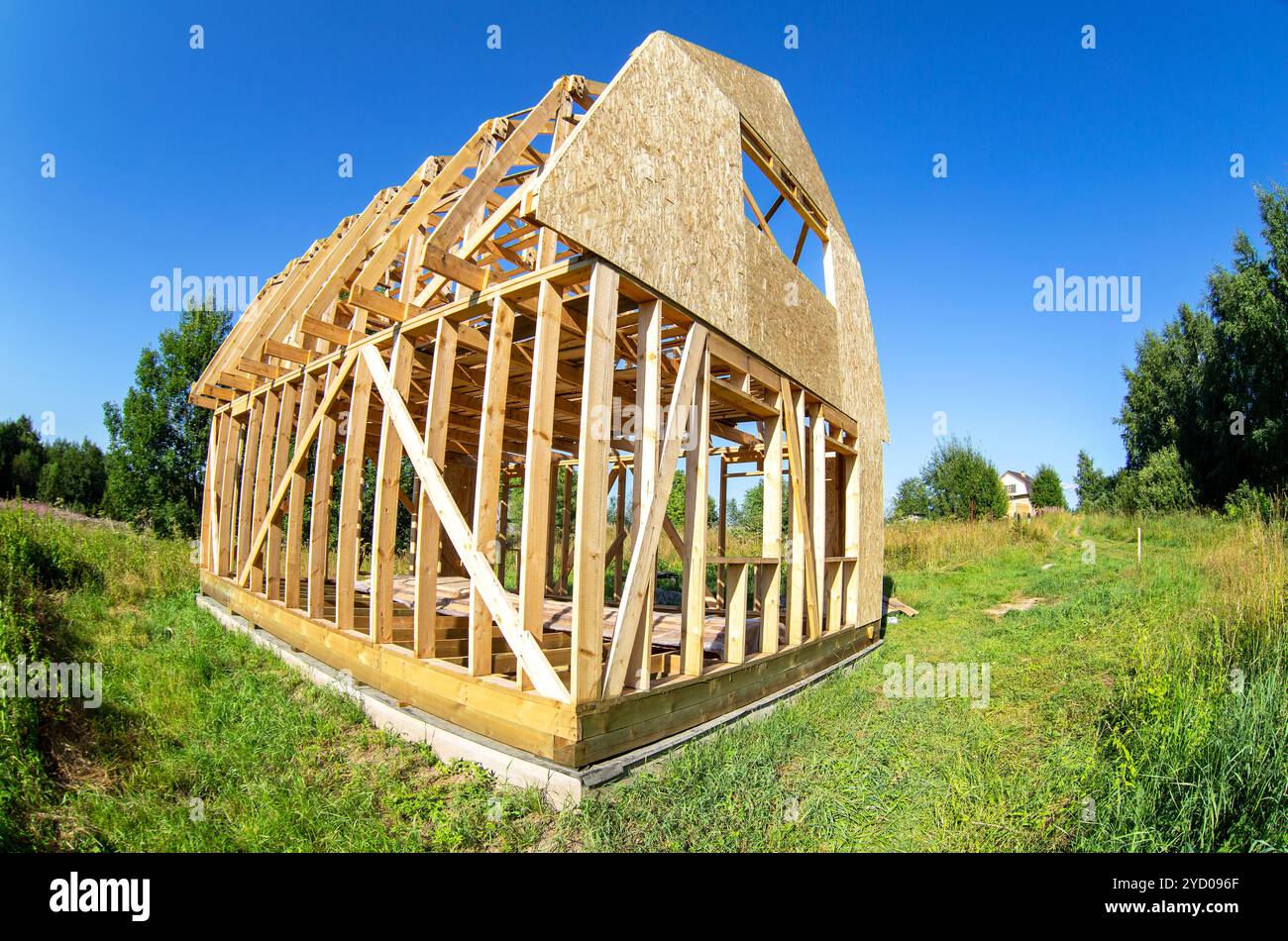 Construction of a new wooden house at the village Stock Photo - Alamy