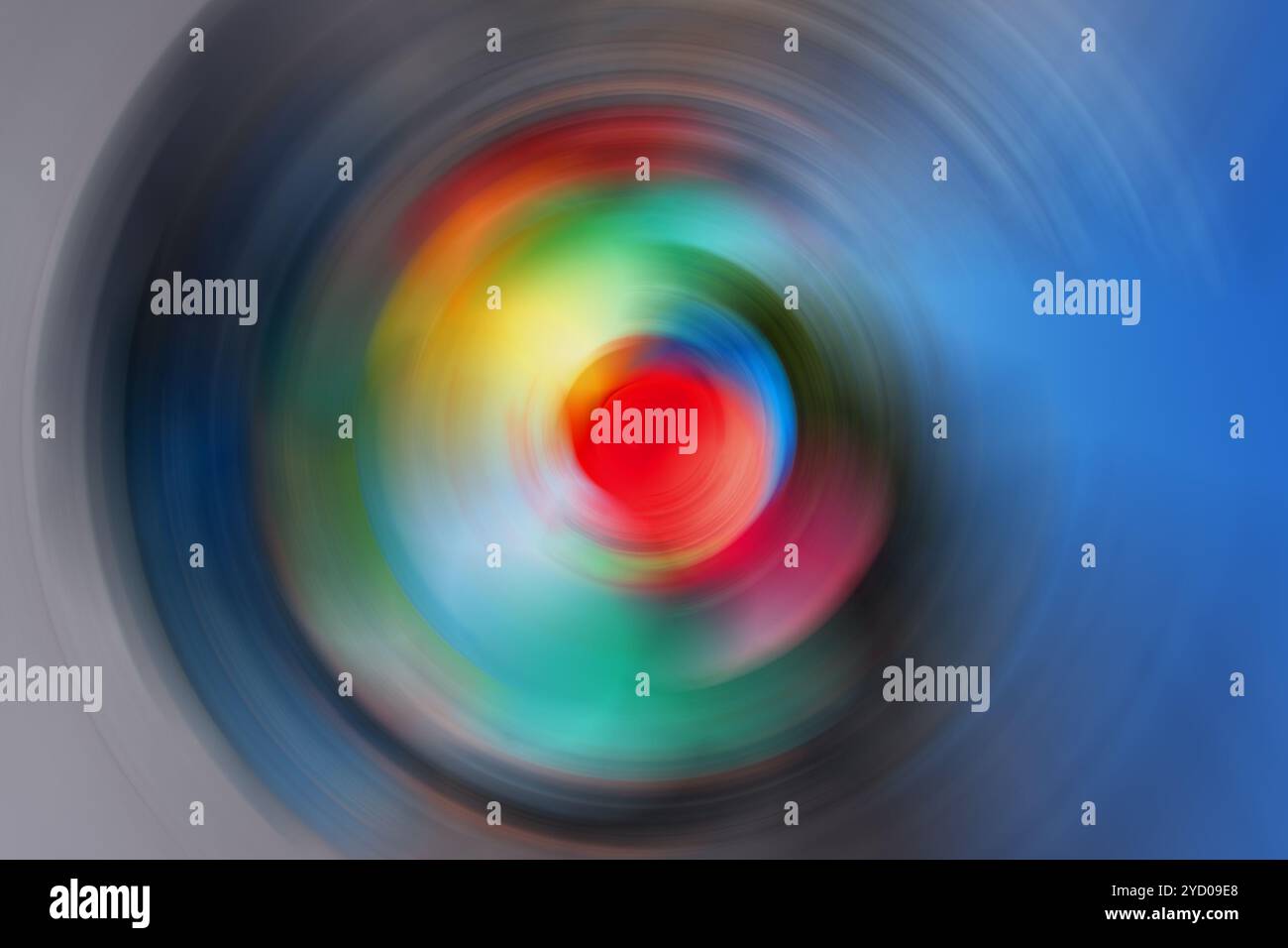 Spinning concentric rings with interplay of colors around a solid red ...