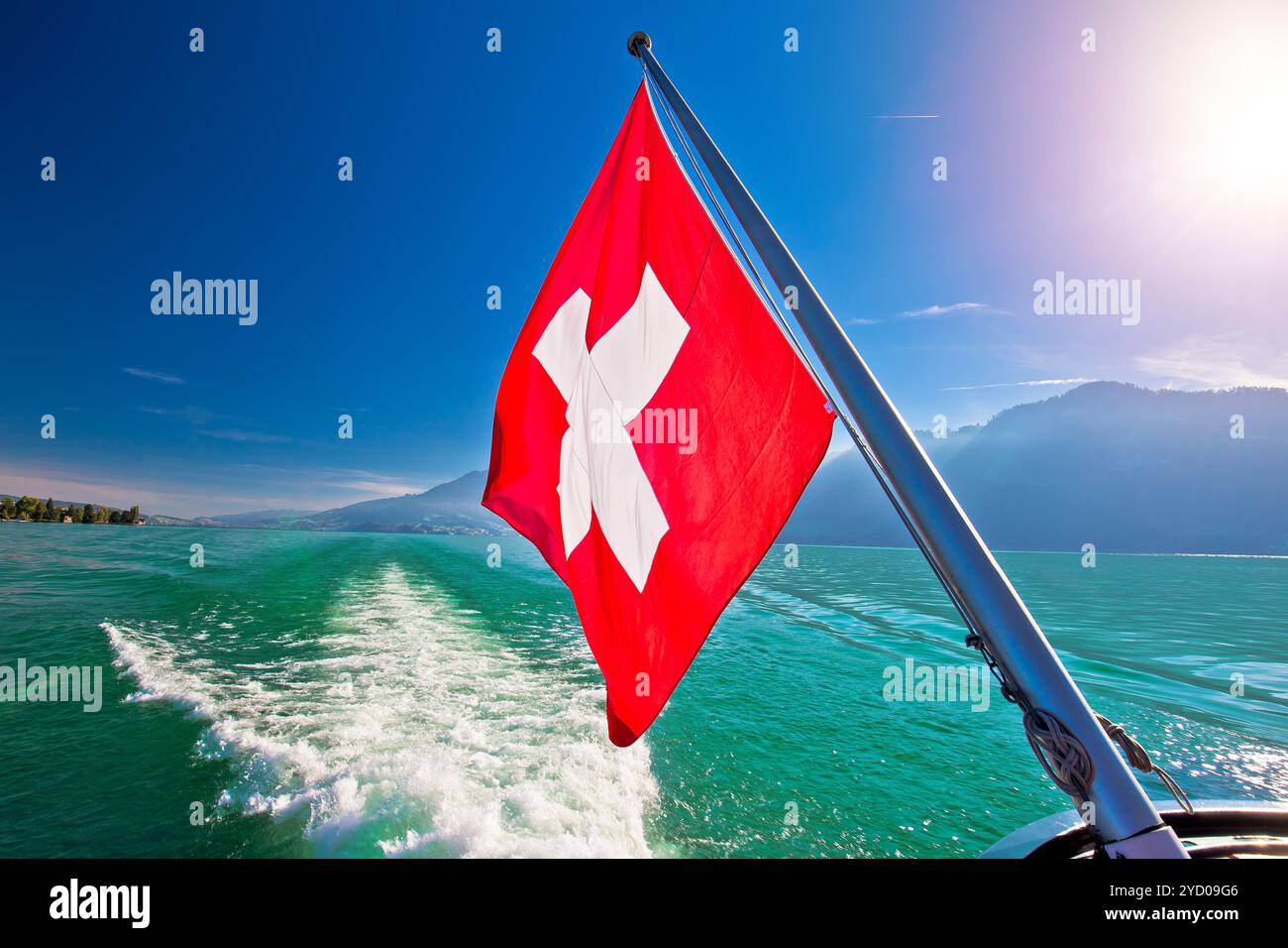 Flowing on idyllic Swiss lake Lucerne boat flag view Stock Photo - Alamy