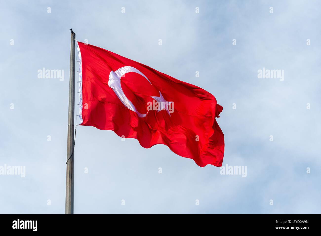 Turkish national flag hang on a pole on sky background Stock Photo - Alamy
