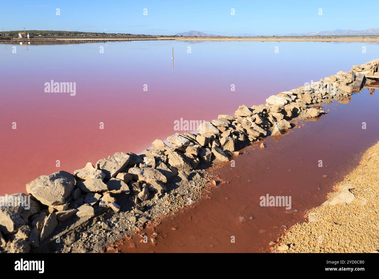 Retaining dikes in the pink lagoon of the Saltworks of the natural park ...