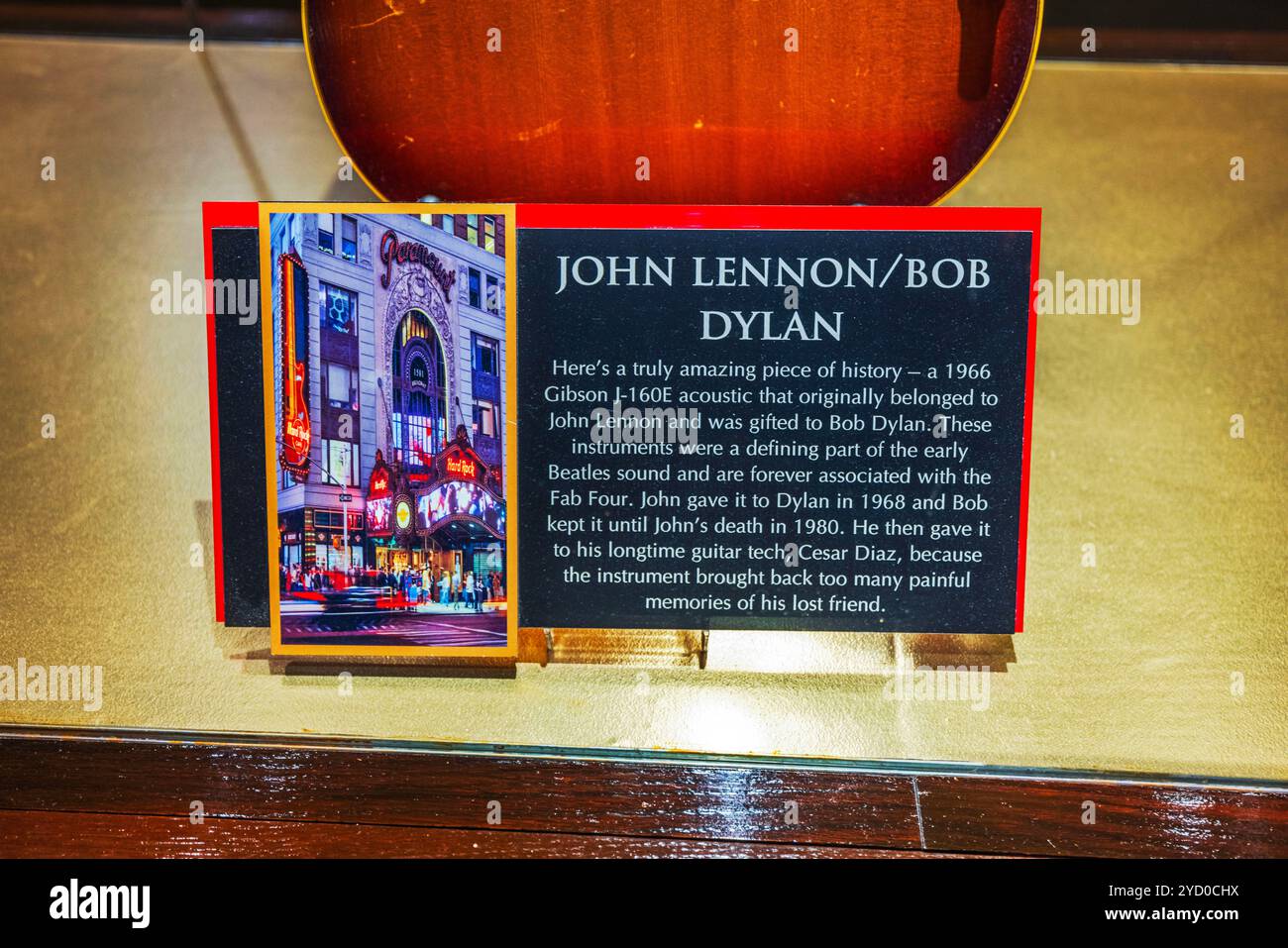 John Lennon's Gibson J-160E guitar, gifted to Bob Dylan, displayed at ...