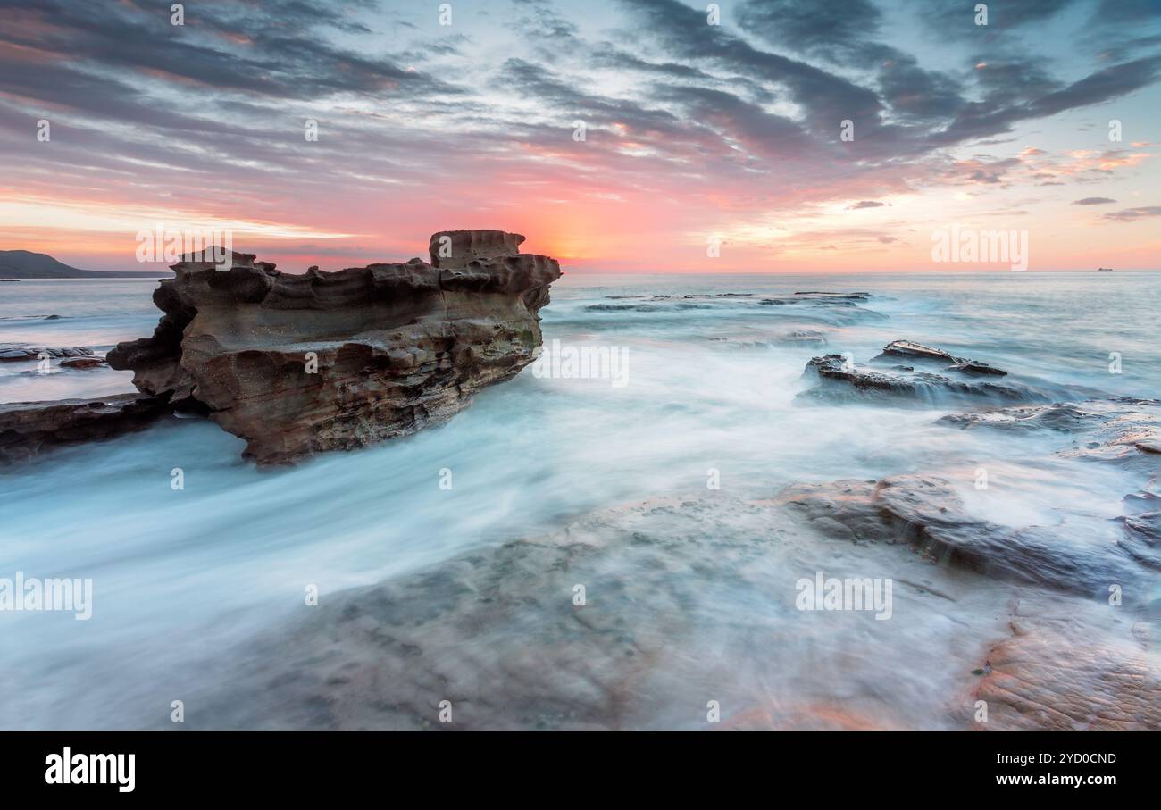 Floating rock ocean current morning sunrise Stock Photo - Alamy