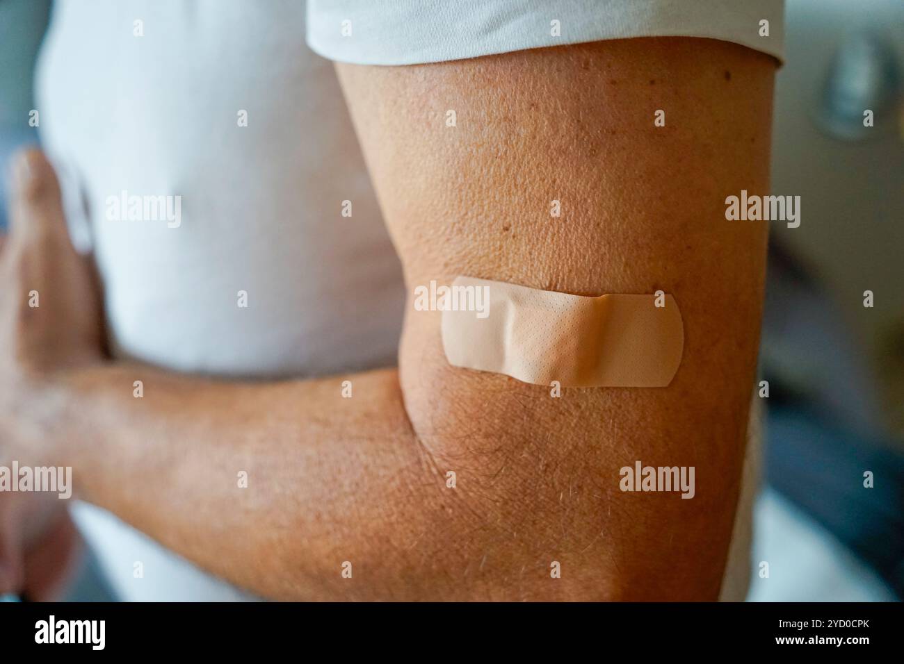 Detail of a man's arm with adhesive plaster for wound care Stock Photo ...