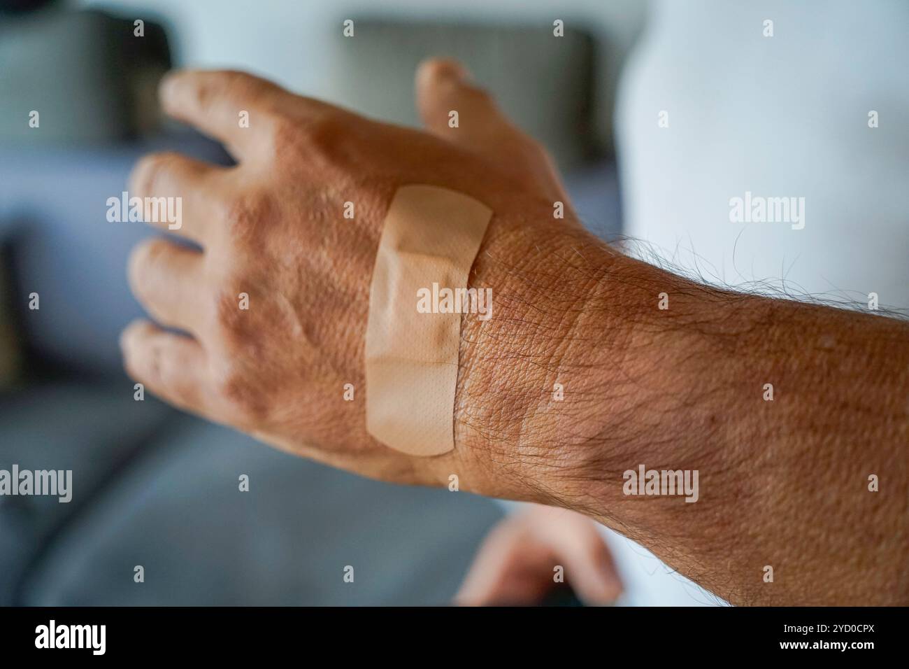 Detail of a man's arm with adhesive plaster for wound care Stock Photo ...