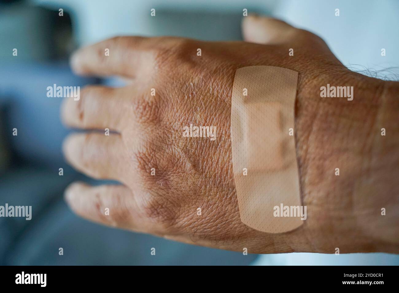 Detail of a man's arm with adhesive plaster for wound care Stock Photo ...