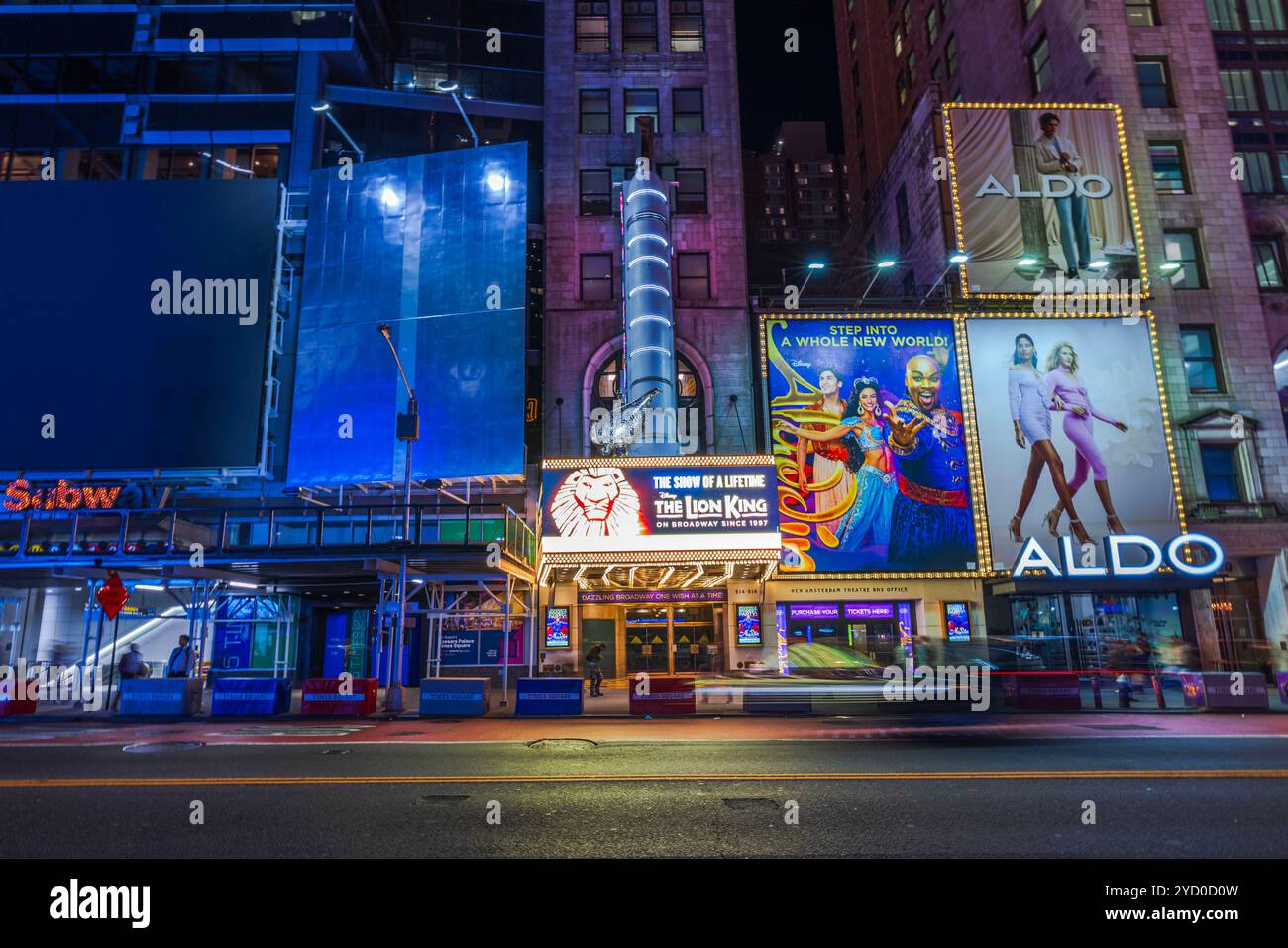 Night view of Broadway with The Lion King and Aladdin theater signs ...