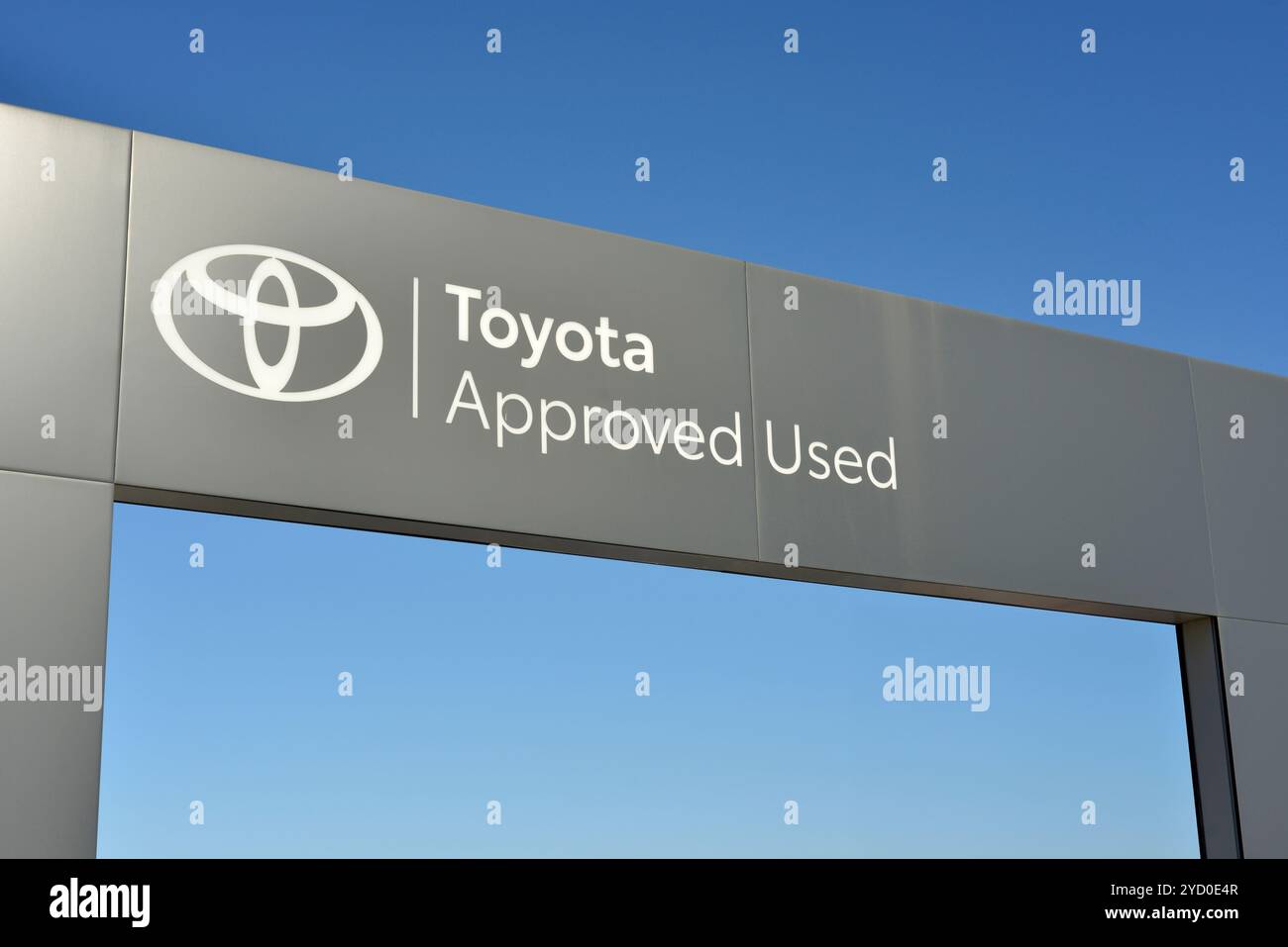 Toyota Approved Used logo and sign on aluminum arch against blue sky at ...
