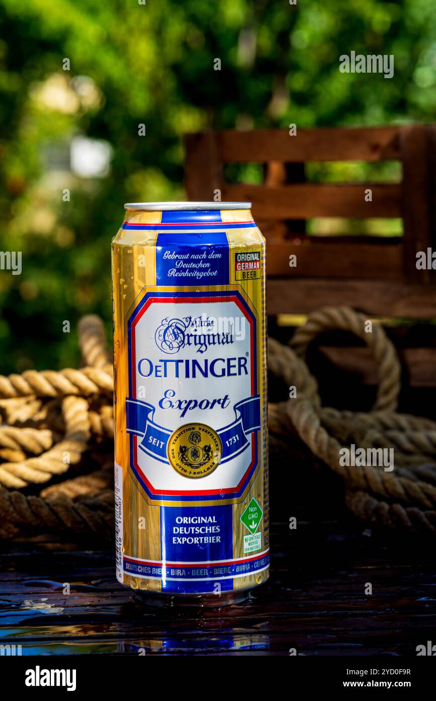 Oettinger beer can - condensation water droplets, outdoors background ...