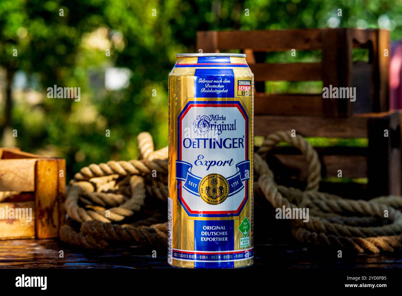 Oettinger beer can - condensation water droplets, outdoors background ...
