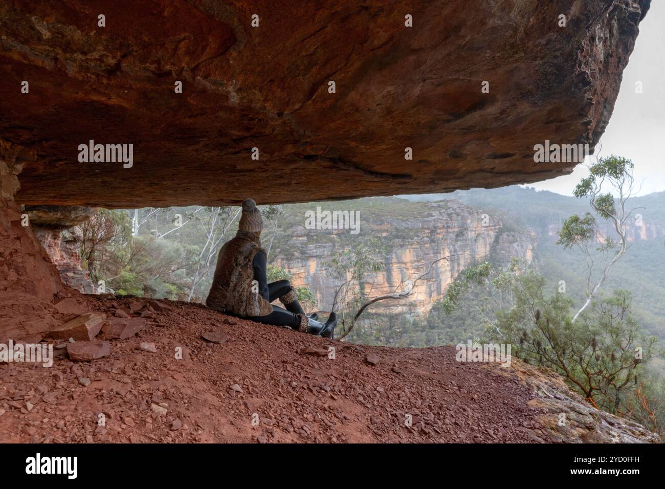 Sitting in the undercliff ledge with views of the Blue Mountains ...