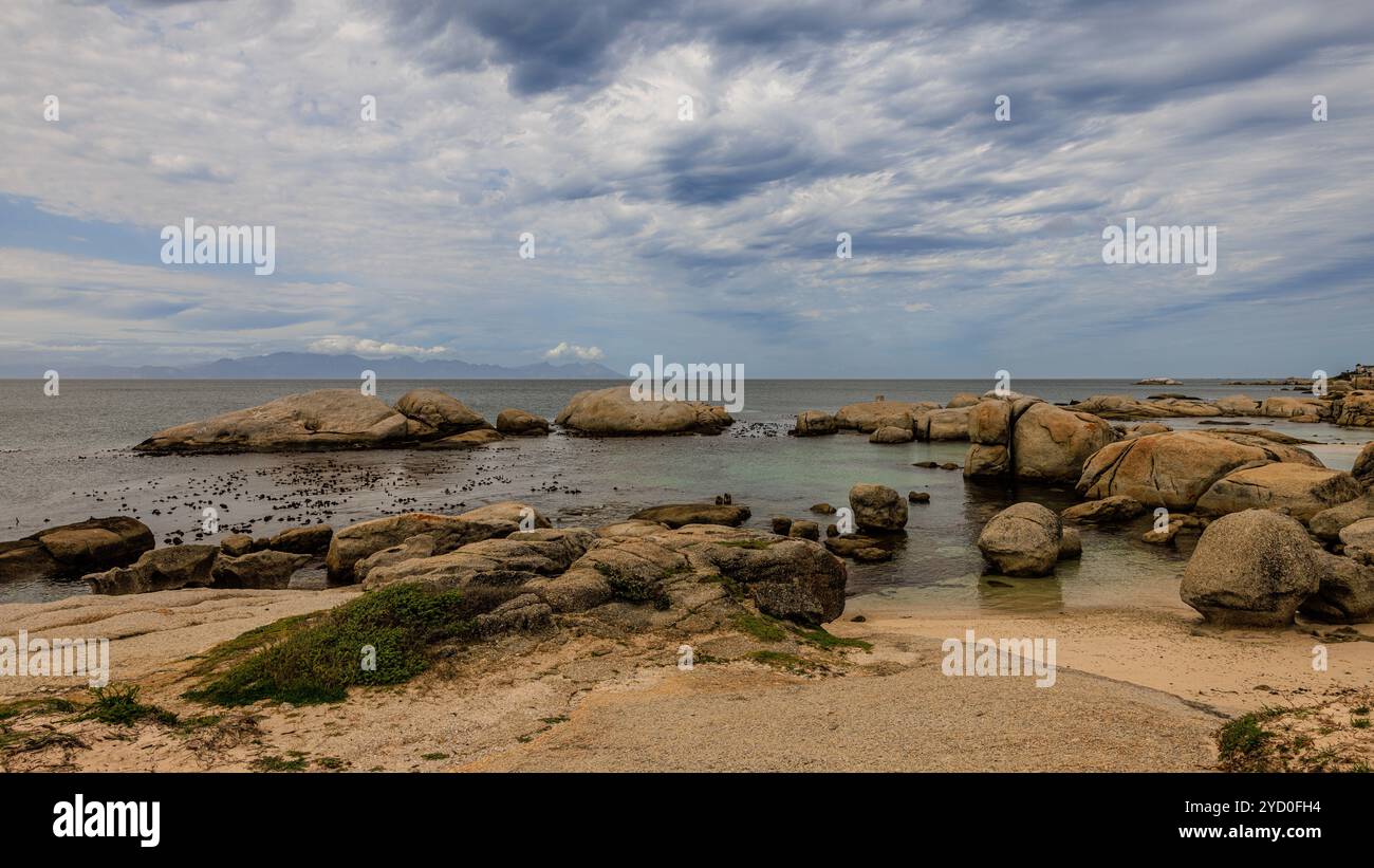 landscape of large granite boulders creating shallow water rock pools ...