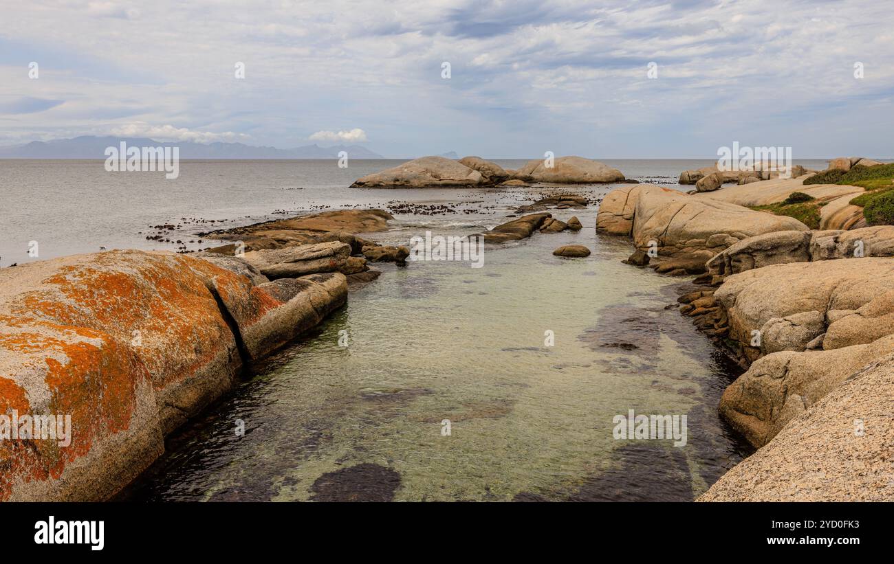 landscape of large granite boulders creating shallow water rock pools ...