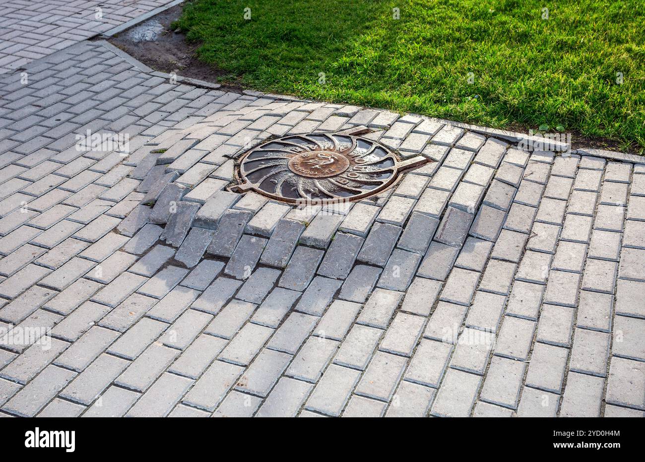 Round metal cover manhole with emblem of Kazan Stock Photo - Alamy