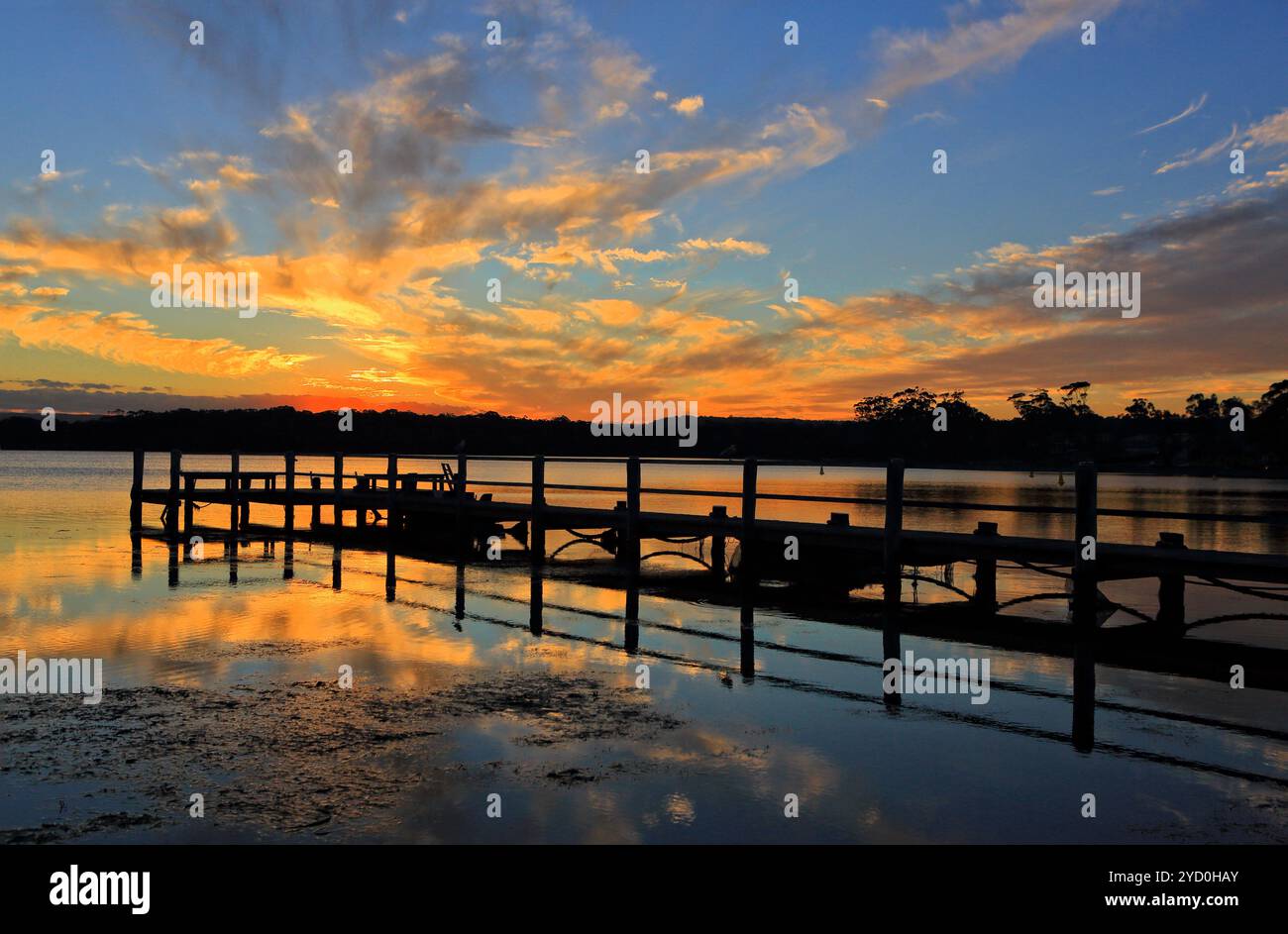 Beautiful sunset and timber jetty silhouette Stock Photo - Alamy