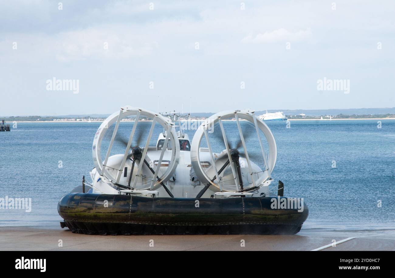 Rear view of hovercraft showing fans and steering fins and skirt fully inflated about to enter ...