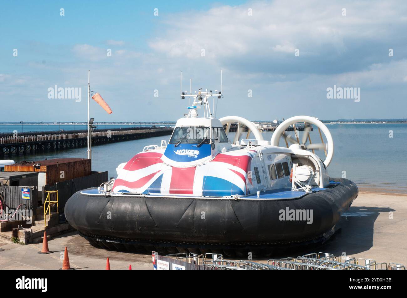 Hovercraft with skirt fully inflated getting ready to make ferry crossing with passengers across ...