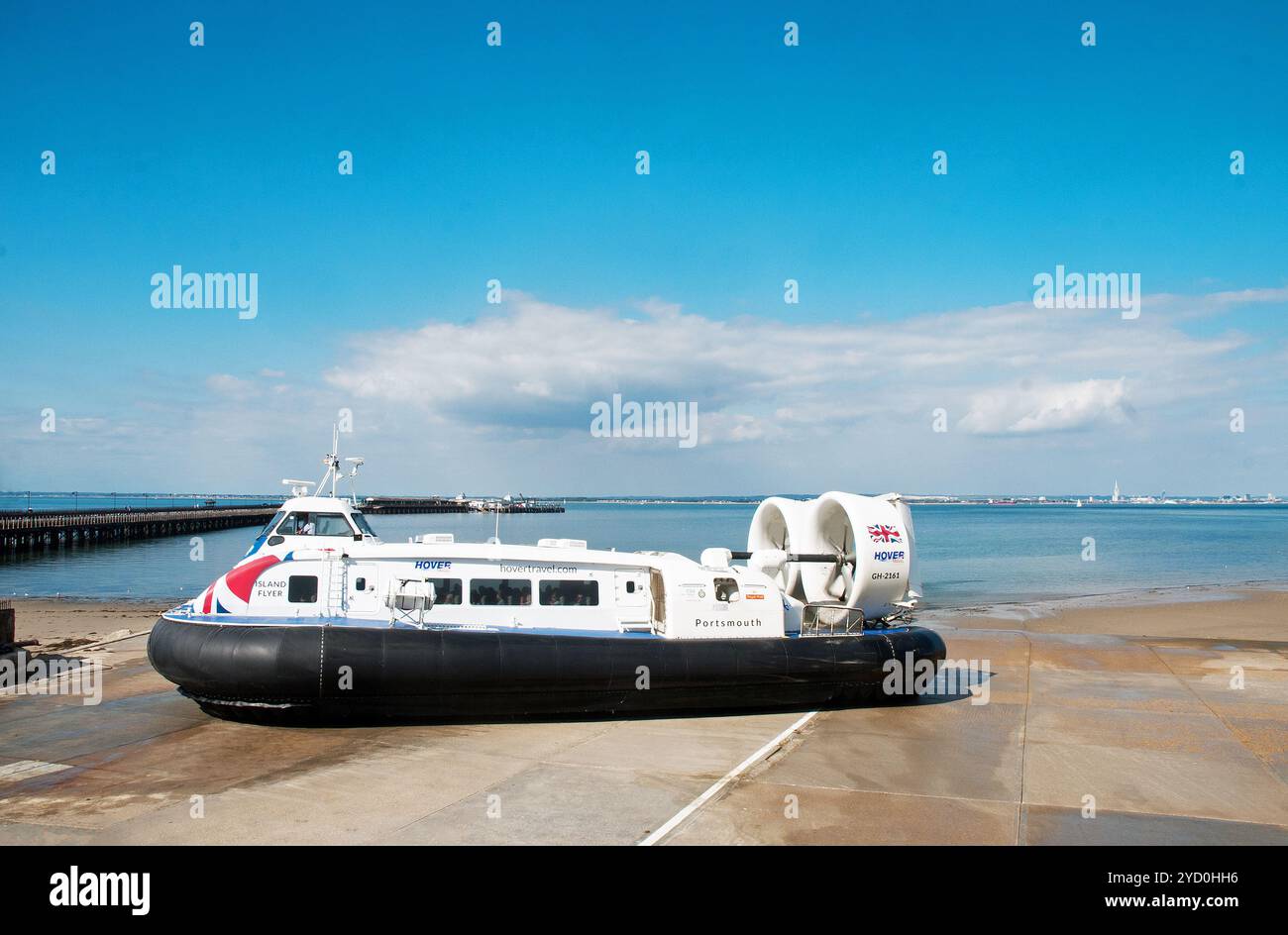 Hovercraft with skirt fully inflated moving to boarding bay to collect ...