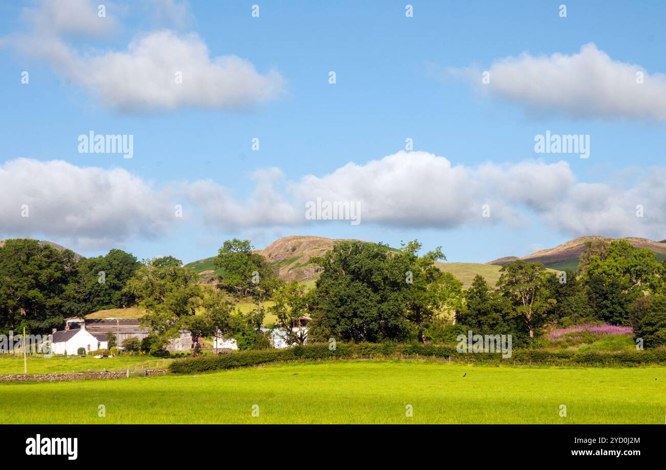 This is a picture of the landscape showing farm buildings trees and ...