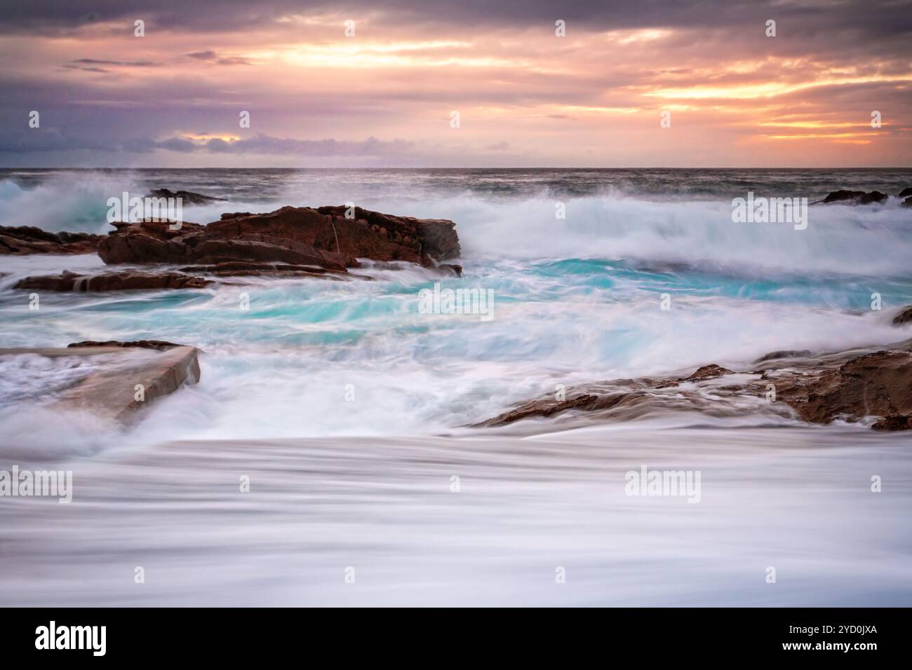 Rock Pool overflows in large swells Stock Photo - Alamy