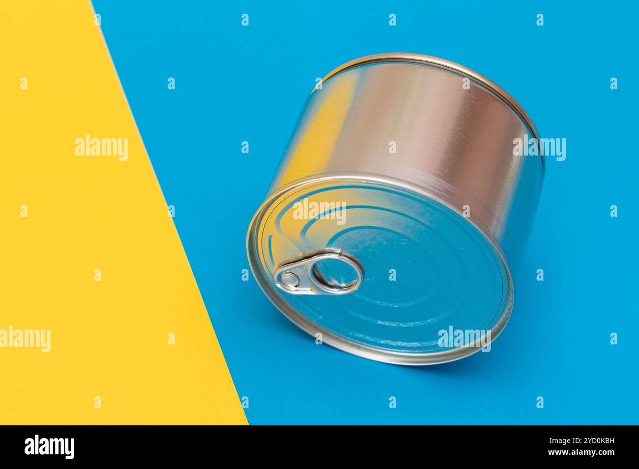 Tin Can on Split Blue and Yellow Background. Canned Food. Aluminum Can ...